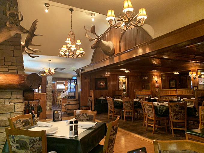 Step inside and you're transported to a carnivore's paradise where antler chandeliers cast a warm glow over wooden tables ready for serious meat consumption.
