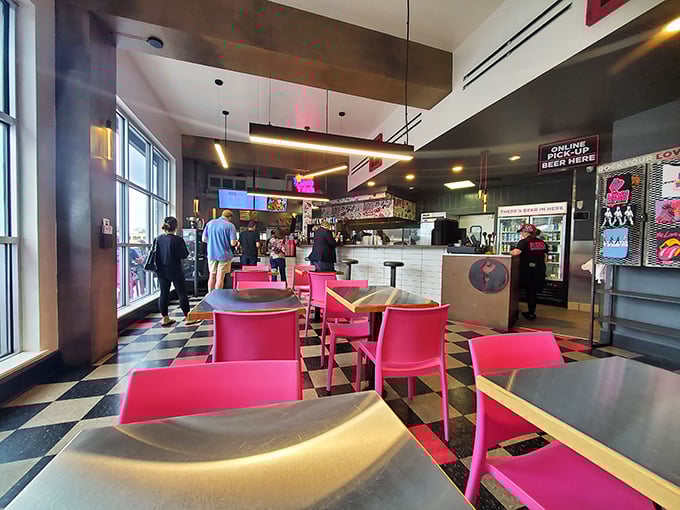 Step inside and the retro-meets-rock-and-roll vibe hits you immediately. Those pink chairs aren't just furniture&mdash;they're a promise of something bold to come.