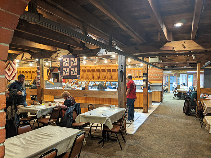 Exposed wooden beams and quilted wall hangings aren't trendy design choices here&mdash;they're authentic pieces of Ohio heritage holding decades of dining memories.