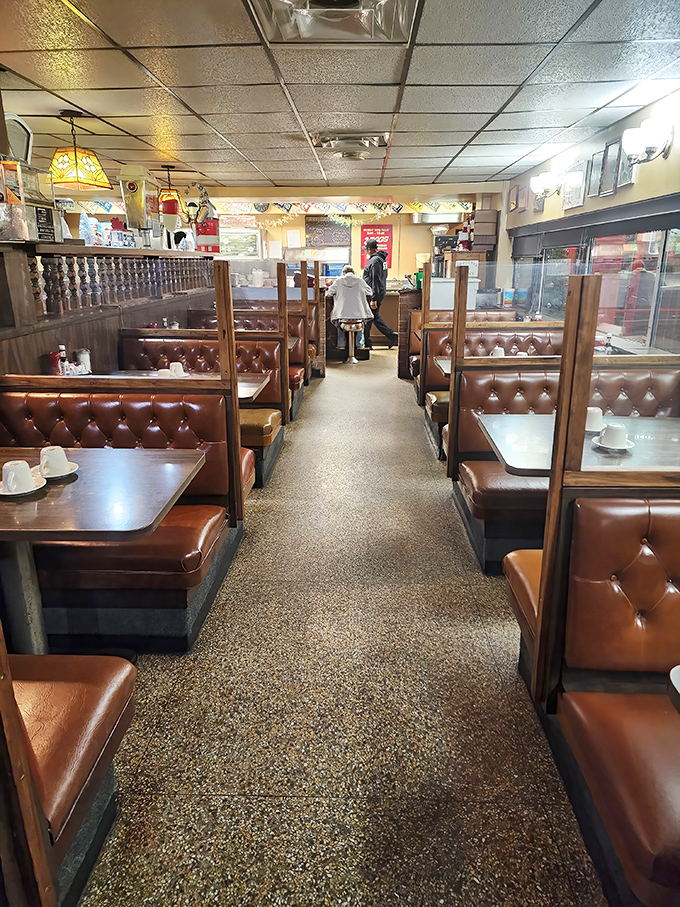 Classic diner perfection awaits inside with those tufted brown vinyl booths &ndash; the kind that have cradled generations of pancake enthusiasts in their comfortable embrace.