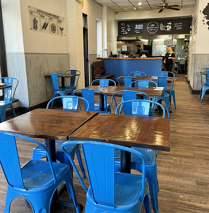 Blue metal chairs and rustic wooden tables create that perfect "we're here for the food, not the frills" atmosphere that serious gyro lovers appreciate.