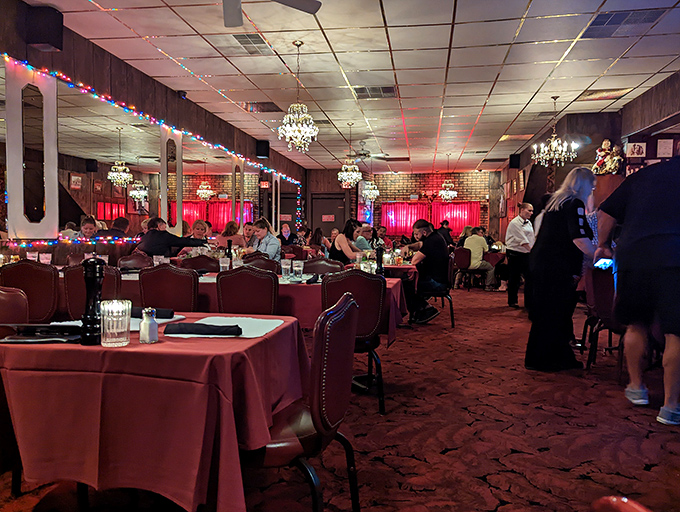 Step into a time capsule of supper club glory, where red tablecloths and crystal chandeliers set the stage for beef-based euphoria.