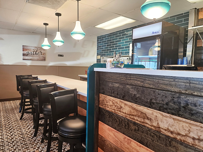Counter seating that invites you to watch the kitchen magic unfold. That "gather" sign isn't just decor&mdash;it's the diner's entire philosophy.