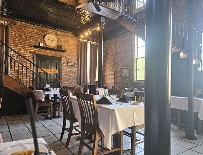 History and hunger meet beneath ornate tin ceilings and exposed brick. The restaurant's interior feels like stepping into Virginia's past, but with much better table settings.