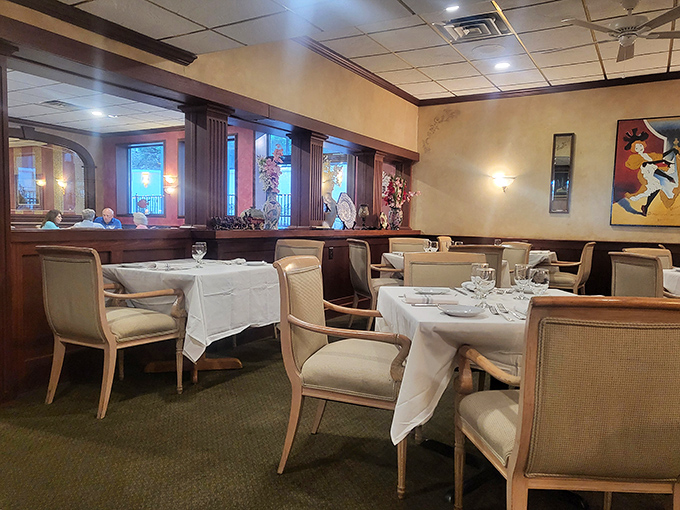 Classic elegance meets comfortable dining in this thoughtfully designed space. White tablecloths whisper "special occasion" while the warm wood tones say "relax and stay awhile."