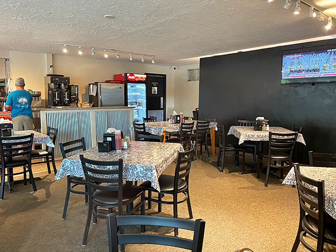 Inside, patterned tablecloths and warm lighting create that perfect "breakfast with friends" atmosphere you've been craving.