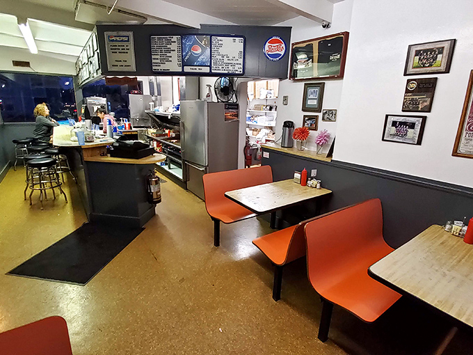 No-frills dining at its finest. The orange booths and simple counter setup say, "We're here for the burgers, not the Instagram backdrop."