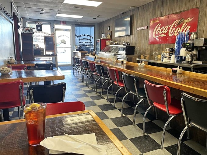 Classic black and white checkered floors, wood paneling, and red vinyl stools&mdash;this isn't retro-chic design, folks, this is the real deal that chains try desperately to replicate.
