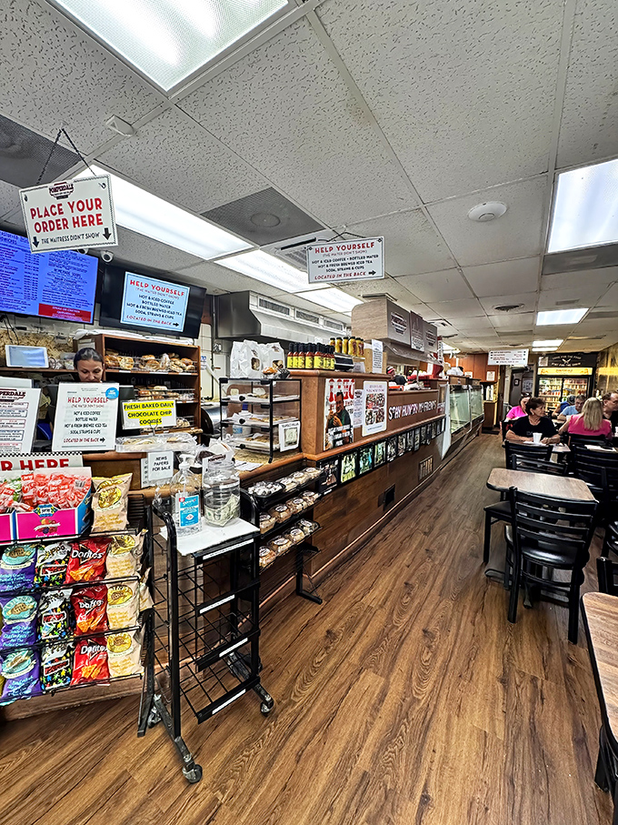 The classic deli interior speaks volumes: "Help Yourself" signs, wooden counters, and the promise of comfort food that transcends zip codes.