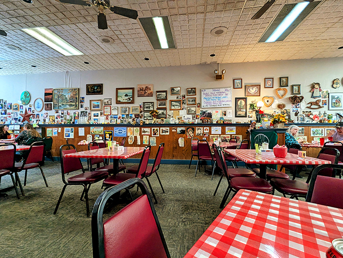 Inside, a gallery of memories covers every wall while red-checkered tablecloths promise no-nonsense comfort food. This isn't d&eacute;cor&mdash;it's a community scrapbook.