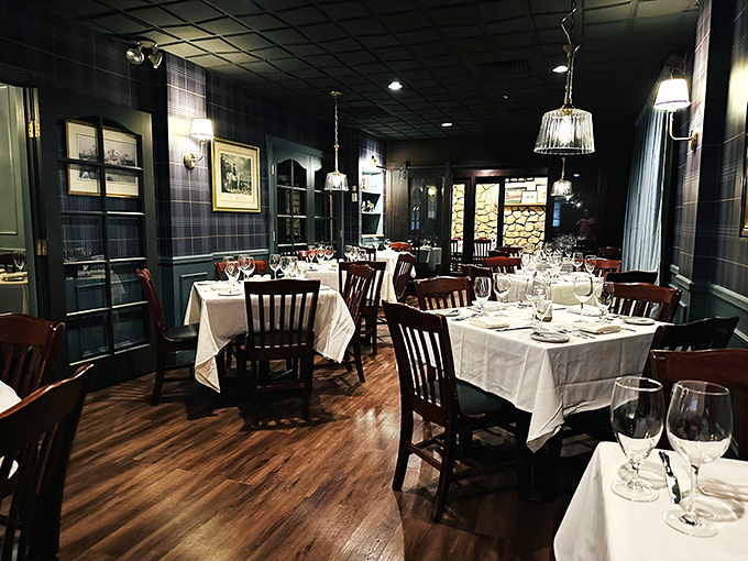 Navy walls and crisp white tablecloths create the perfect backdrop for memorable meals. This isn't just dinner&mdash;it's dinner with dignity.