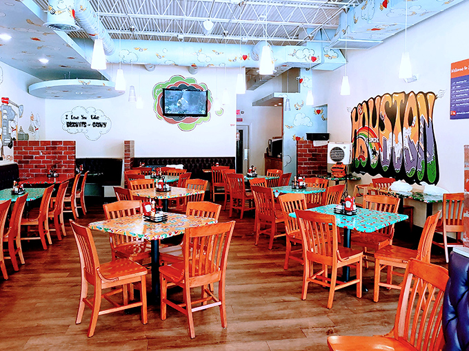 Orange chairs pop like sunshine against walls that whisper "comfort food headquarters" in every corner.