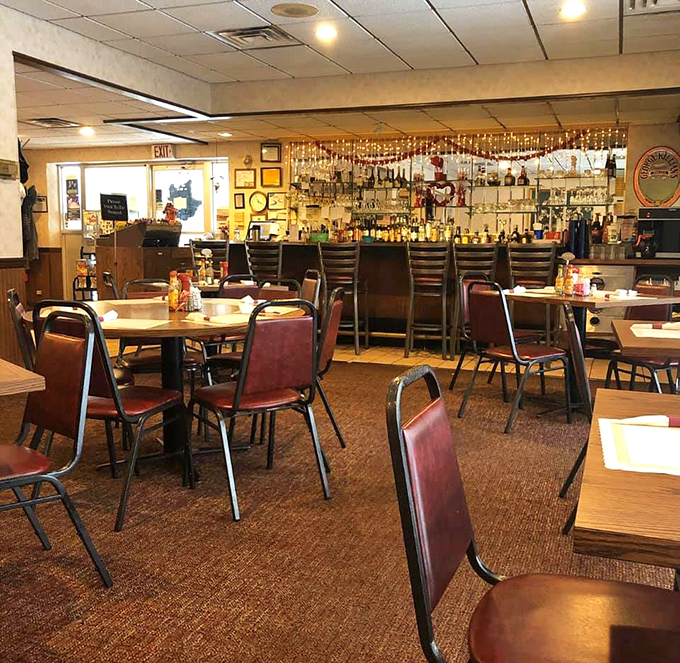 Classic burgundy chairs and wood-paneled walls create that timeless diner atmosphere where conversations flow as freely as the coffee.