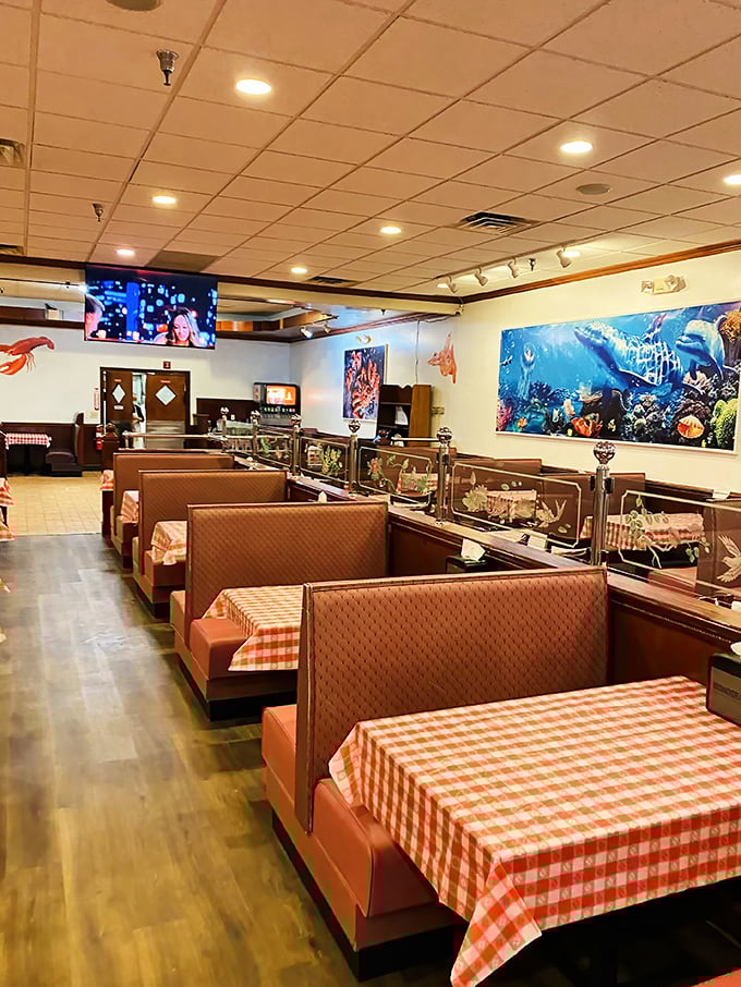 Red-checkered tablecloths and cozy booths set the stage for seafood drama. No pretension here&mdash;just comfortable seating for the messy masterpiece about to unfold.