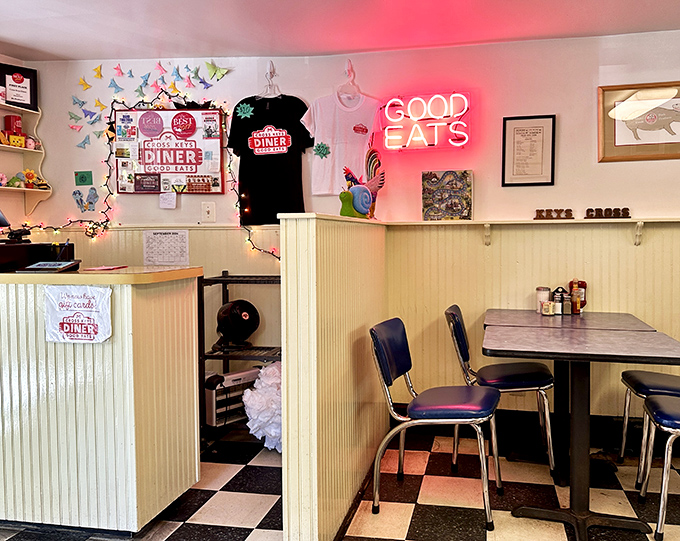 Step inside to a world where colorful paper butterflies dance above cream wainscoting, and that neon "GOOD EATS" sign isn't just decoration&mdash;it's truth in advertising.
