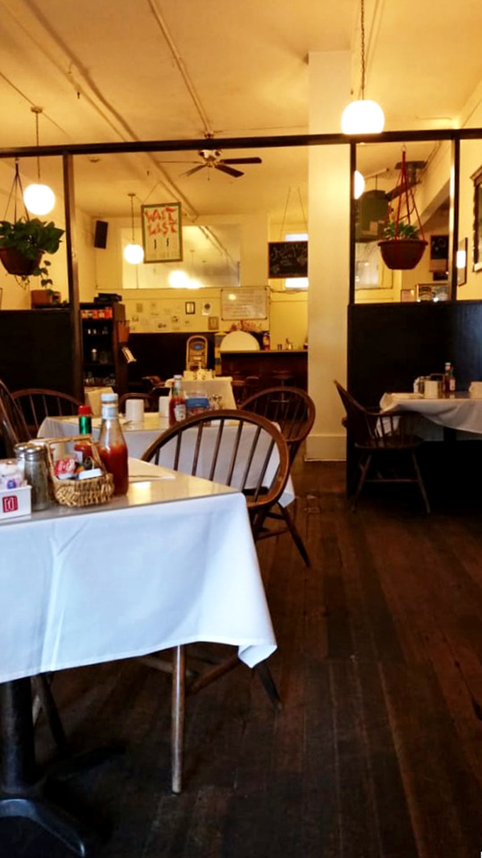 Step inside to a world where Windsor chairs, white tablecloths, and hanging plants create the perfect backdrop for breakfast magic to unfold.