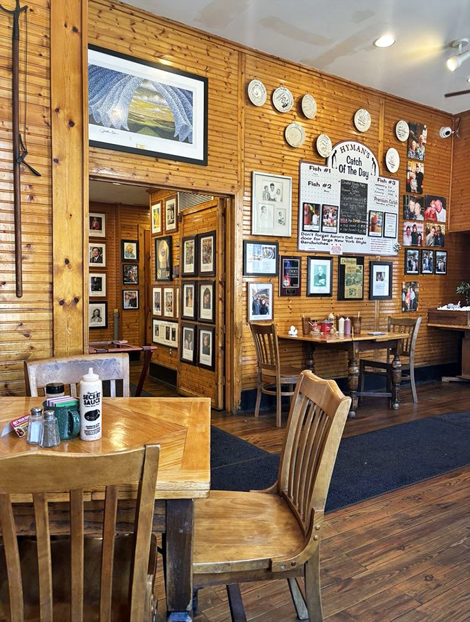 Wood-paneled walls adorned with photos and memorabilia create that perfect "been-here-forever" vibe that no designer could replicate if they tried.