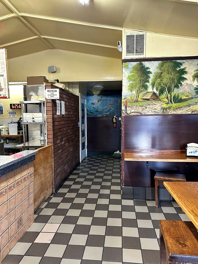 Classic checkered floors and rustic wooden benches set the stage. This isn't interior design&mdash;it's taco authenticity in its natural habitat.