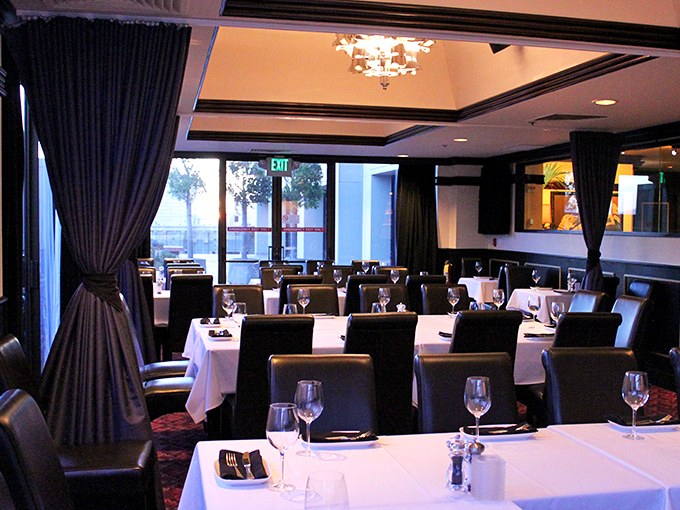 A symphony in black and white awaits diners in Osso's sophisticated dining room, where crisp linens and plush seating set the stage for memorable meat-centric performances.