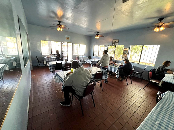 Simplicity reigns supreme inside with checkered tablecloths and ceiling fans that have witnessed decades of satisfied sighs and clean plates.
