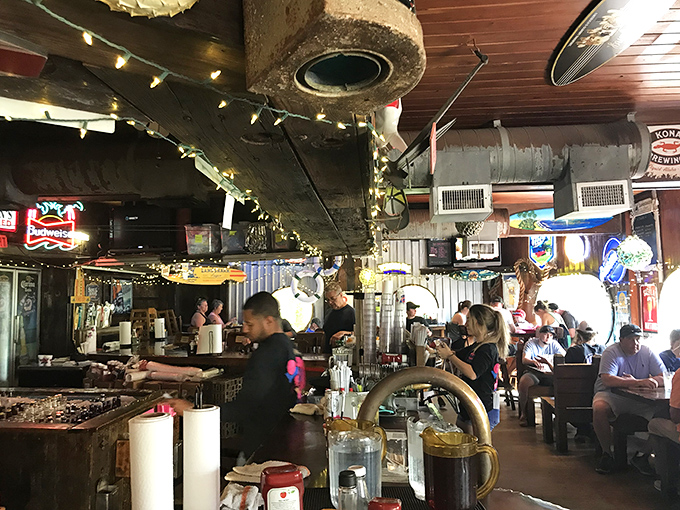Where fishing memorabilia meets cold beer and good times. The dollar-adorned ceiling tells stories of countless happy meals shared beneath.