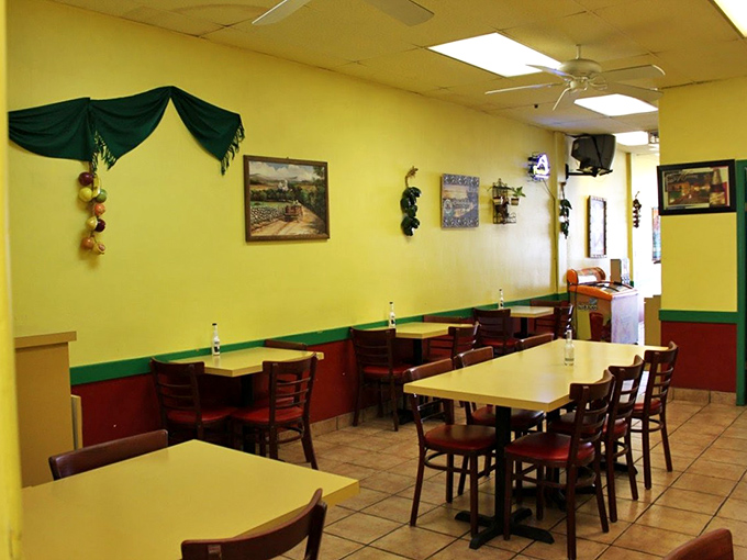 Sunshine yellow walls and simple furnishings create that perfect "abuela's kitchen" vibe where culinary magic happens without pretension.