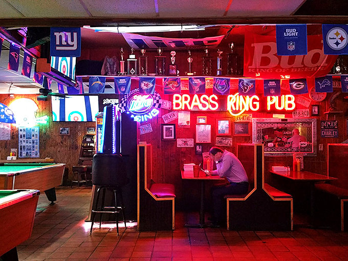Where sports memorabilia meets burger magic. The neon glow of the Brass Ring sign has illuminated countless celebrations and consolations over cold beers.