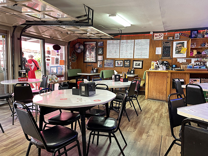 Inside, time stands deliciously still. Wood paneling and no-nonsense tables create the perfect stage for burger magic to happen.