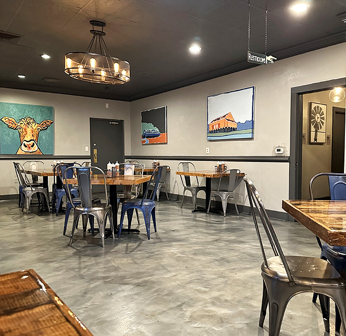 Modern industrial meets Southern comfort in this dining space where colorful local art (hello, cow portrait!) reminds you that good barbecue starts with respect for the animal.