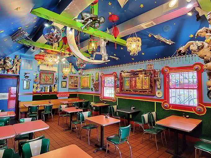 Dining under a celestial canopy of toys, trinkets, and treasures. The ceiling alone contains more whimsy than most children's museums.