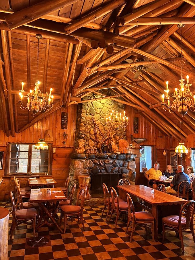 Beneath timber beams that soar like a wooden cathedral, diners bask in the warm glow of chandeliers while stone fireplaces promise cozy comfort even on Michigan's chilliest evenings.