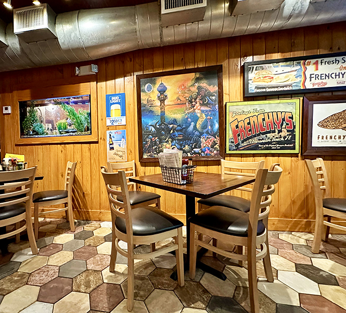 Classic wood-paneled walls and maritime artwork create that perfect "you've discovered something special" vibe, like stumbling upon a secret fishing club.