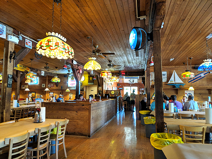 Warm wooden beams and colorful stained glass lamps create the perfect backdrop for seafood feasts that feel like maritime celebrations.