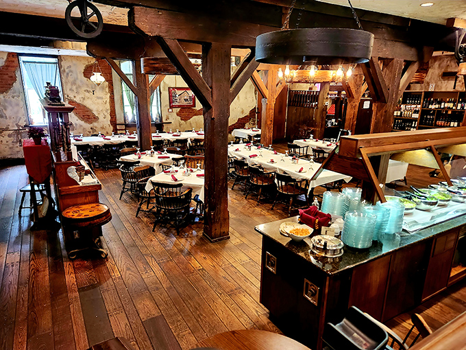 Massive wooden beams frame the dining room, where history and hospitality meet. Those timber supports have witnessed more conversations than a small-town barber shop.