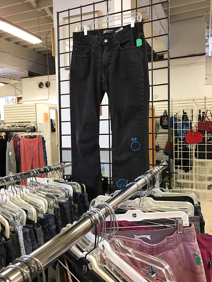 Denim dreams come true here. That blue embroidery adds character to basic black jeans—someone's fashion experiment becomes your statement piece.