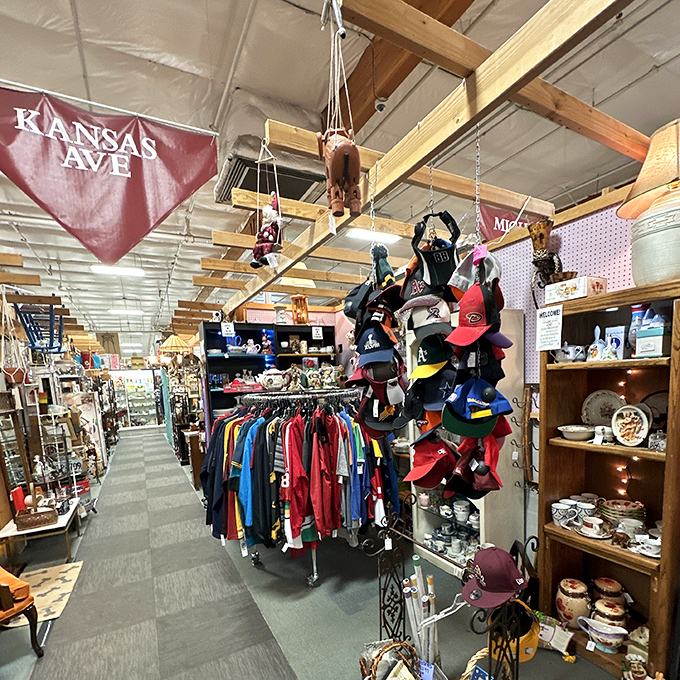 Kansas Avenue stretches before you like a runway of nostalgia. Baseball caps dangle like colorful fruit while vintage clothing waits for its second act.