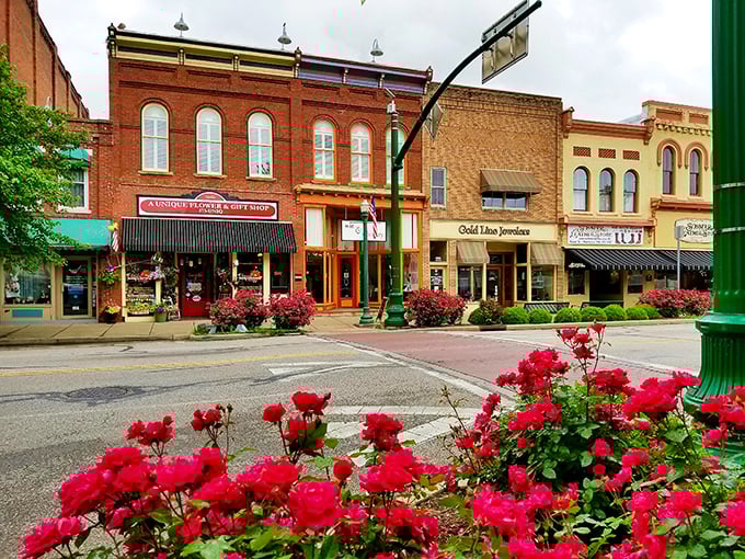 Front Street's vibrant storefronts pop with color against brick sidewalks, while hanging flower baskets add nature's exclamation points to this historic district.