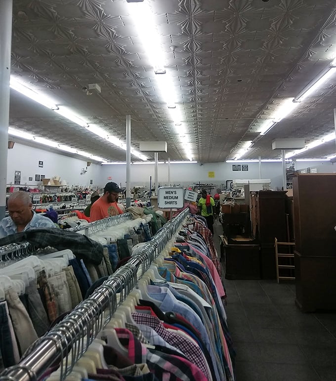 Endless racks of potential wardrobe upgrades stretch toward the horizon. The vintage tin ceiling watches over decades of fashion history waiting for rediscovery.