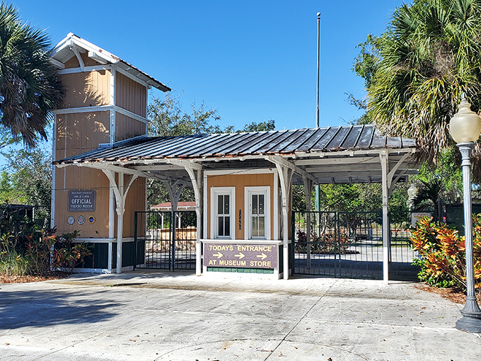 Florida sunshine greets visitors at the charming station-style entrance, where palm trees and railroad heritage create a uniquely Sunshine State welcome.