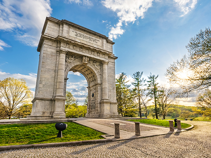 The National Memorial Arch stands like a Roman triumph transplanted to Pennsylvania soil&mdash;history's exclamation point against a perfect blue sky.