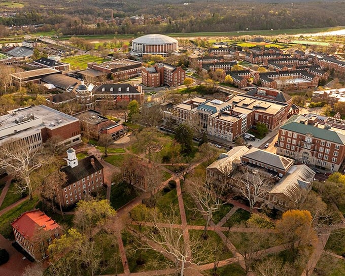 Ohio University's campus sprawls across Athens' rolling hills like a brick-and-mortar quilt, the iconic Convocation Center standing sentinel over academic life.