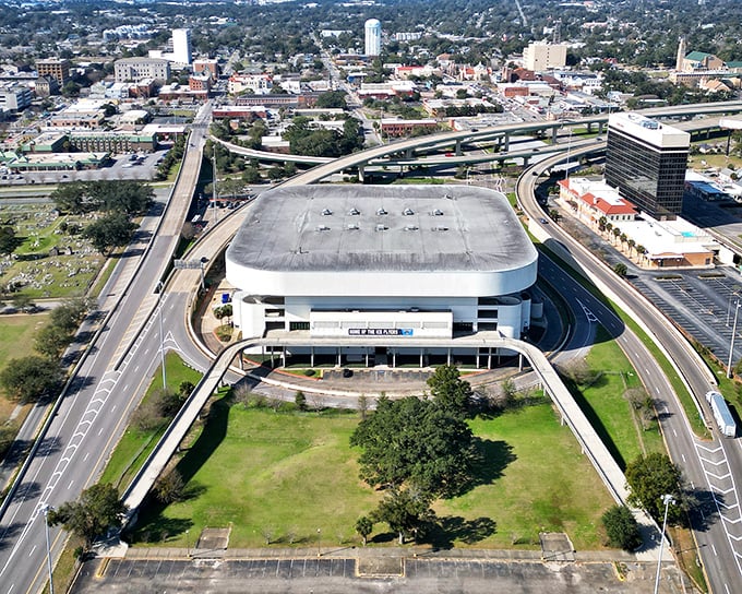 The Pensacola Bay Center stands like a modern coliseum amid the coastal landscape. Inside, hockey fans and concert-goers share the same battle cry: "Did you see where I parked?"
