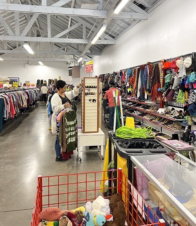 Serious shoppers navigate the well-organized clothing section, where yesterday's fashion finds new life and new owners.