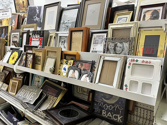 A gallery of empty frames awaits your memories and masterpieces, proving one person's decluttered living room becomes another's decorating goldmine.