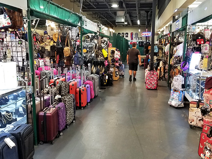 Luggage as far as the eye can see! Every color, pattern, and size imaginable lines this aisle—your suitcase soulmate is waiting somewhere in this rainbow of travel companions.