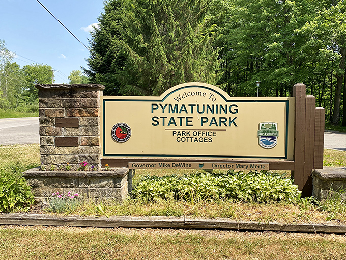 The gateway to adventure! This unassuming sign marks the threshold between ordinary life and the extraordinary natural playground waiting beyond.