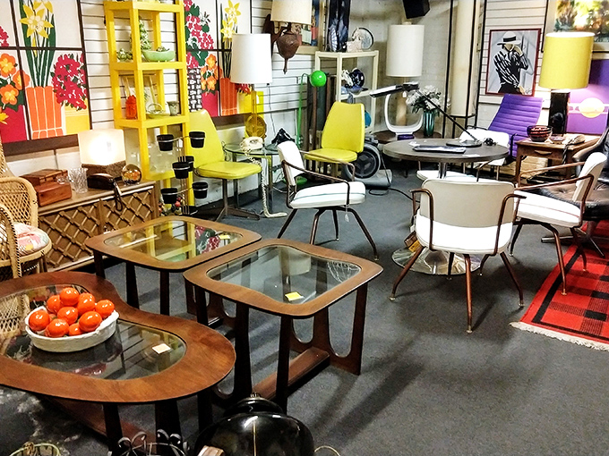 Mid-century modern heaven where every chair tells a story. That yellow accent piece isn't just furniture&mdash;it's a conversation waiting to happen.