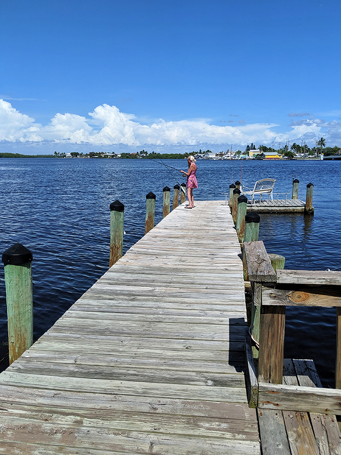 The simple joy of fishing from a weathered dock&mdash;where catching nothing still feels like winning when the view is this spectacular.