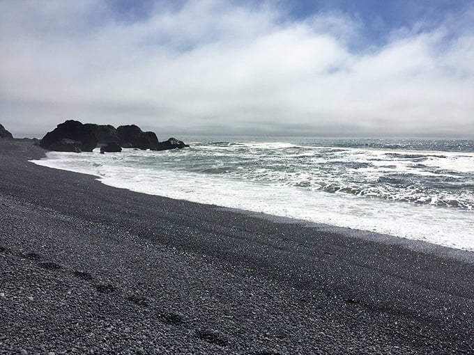 Moody skies transform Black Sands Beach into a monochromatic masterpiece where the Pacific's power is on full display.