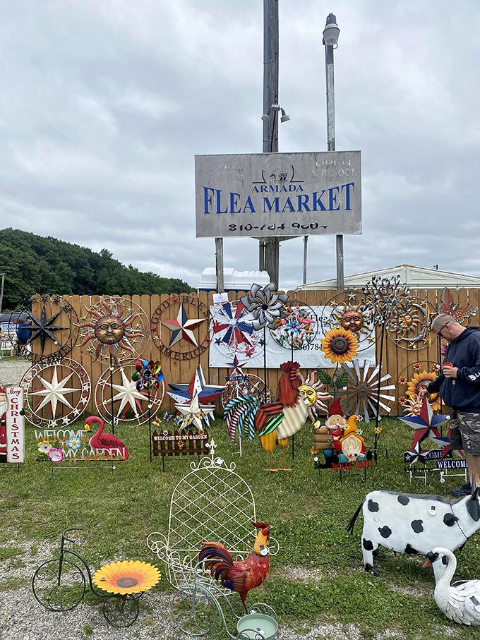 The sign promises treasures, but the garden art display delivers immediate gratification. One person's metal sunburst is another's perfect patio statement piece.